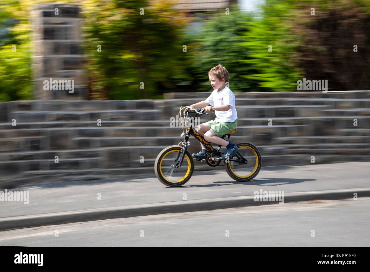 Cyclist riding on pavement hi-res stock photography and images - Alamy