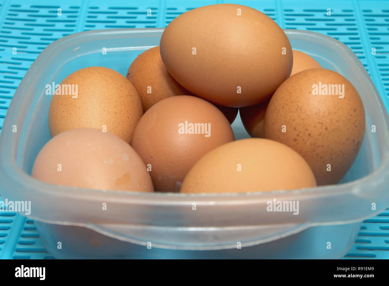 Some Eggs On The Table With Blue Base Stock Photo - Alamy