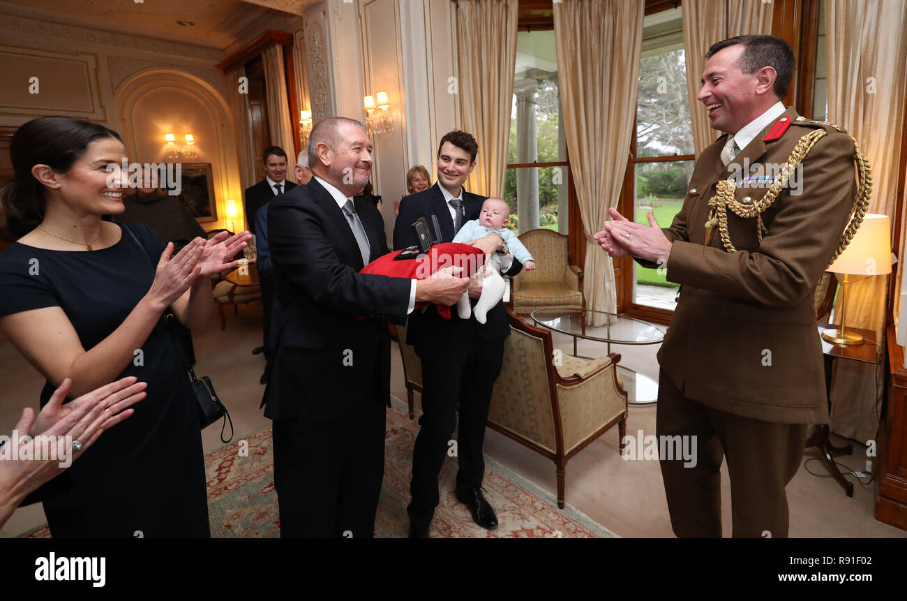 Corporal Tom McGrath's service medals are presented to his son Tom ...