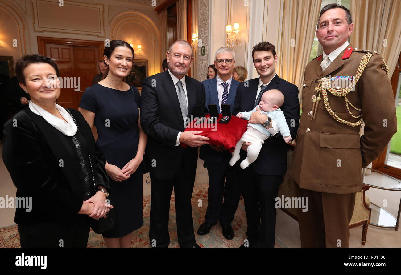 Corporal Tom McGrath's service medals are presented to his family (left ...
