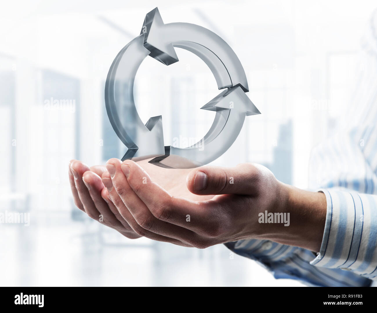 Web refresh icon in male hands as symbol for internet use. Mixed Stock ...