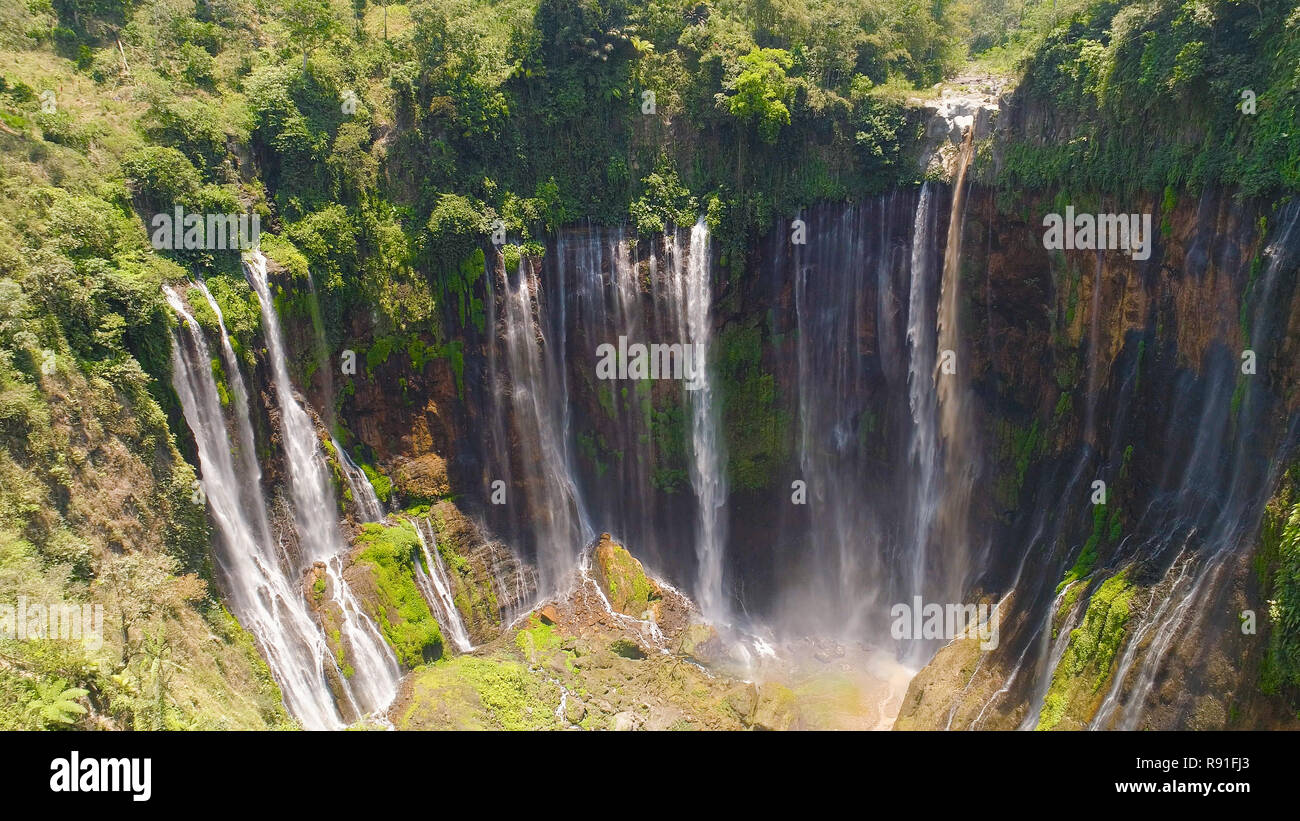 beautiful waterfall Coban Sewu in tropical forest, Java Indonesia ...
