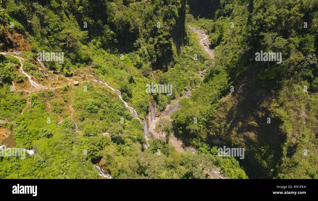 beautiful waterfall Coban Sewu in tropical forest, Java Indonesia ...