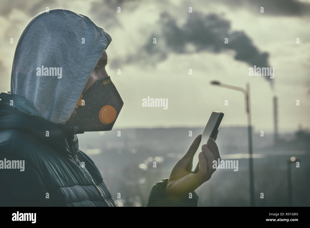 Man wearing a real anti-pollution, anti-smog and viruses face mask and ...