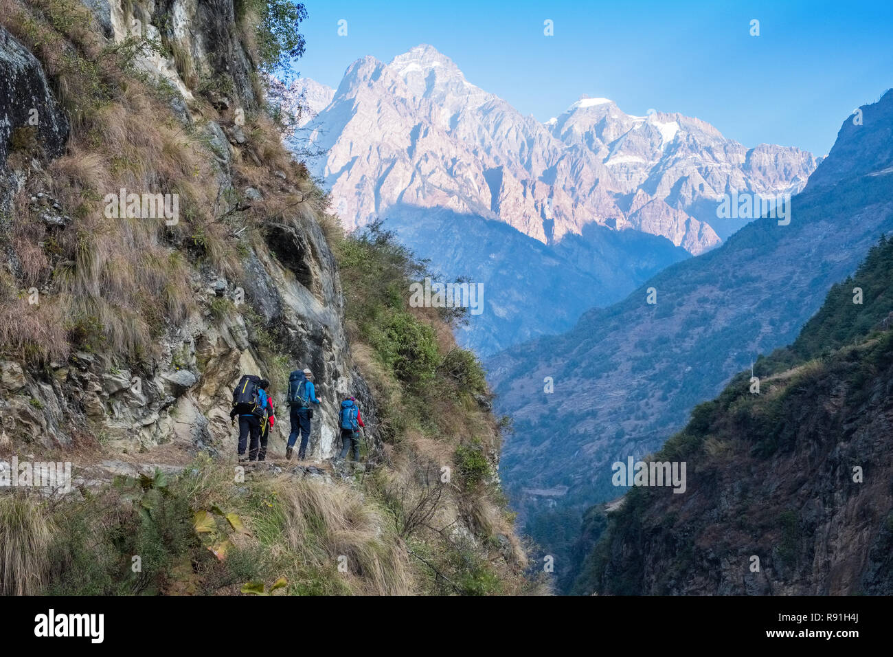 Trekkers on a precipitous path in The Budhi Gandaki valley on the ...
