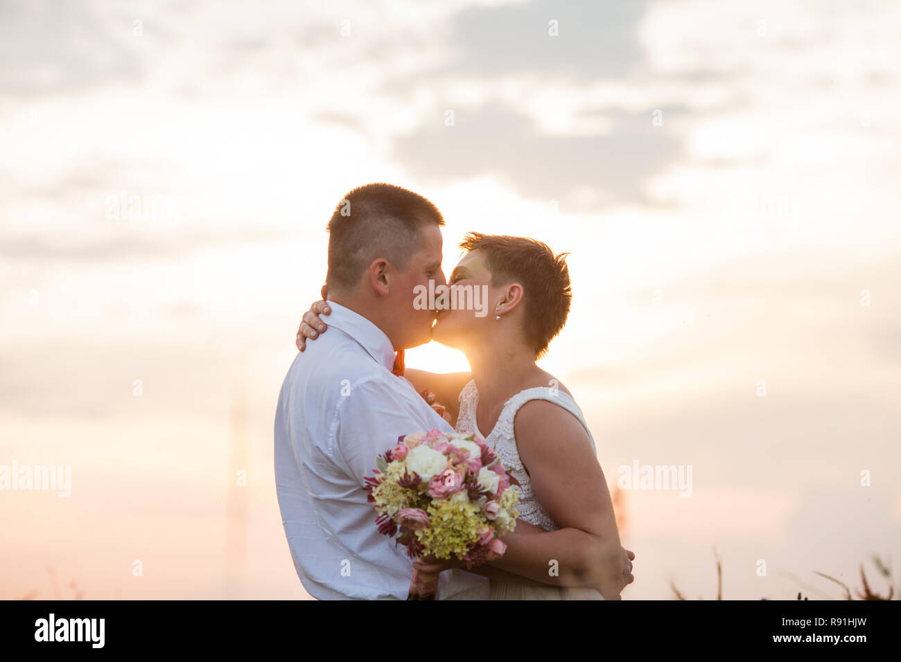 Nature romantic couple outdoor in the sunset Stock Photo - Alamy