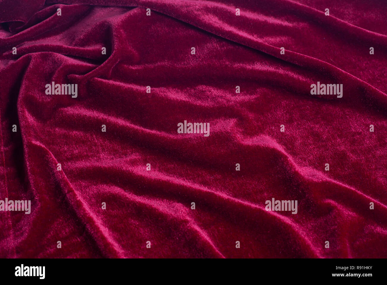Red velvet fabric background texture Stock Photo - Alamy