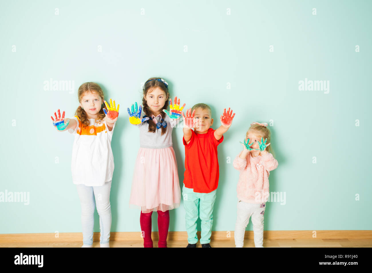 Creative children showing their colorful painted hands Stock Photo - Alamy