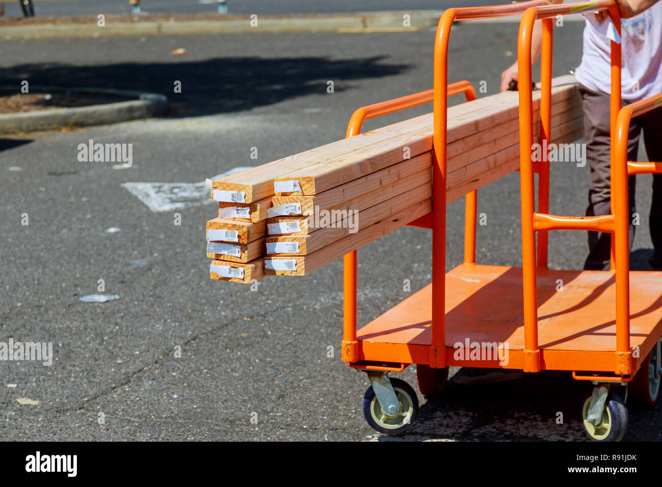 Wood stacked on shelving inside a lumber yard Stock Photo - Alamy