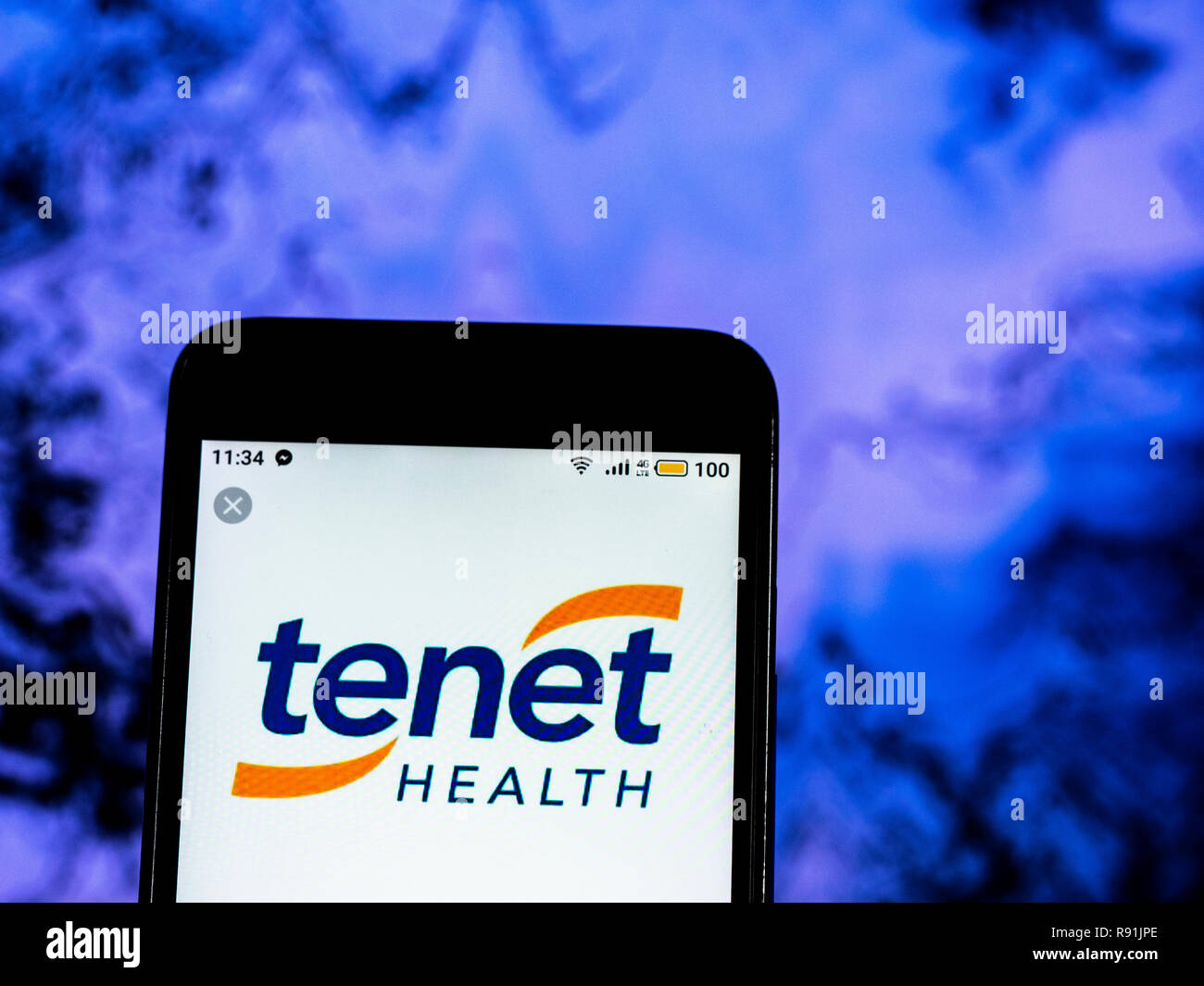 Tenet Healthcare company logo seen displayed on smart phone Stock Photo ...