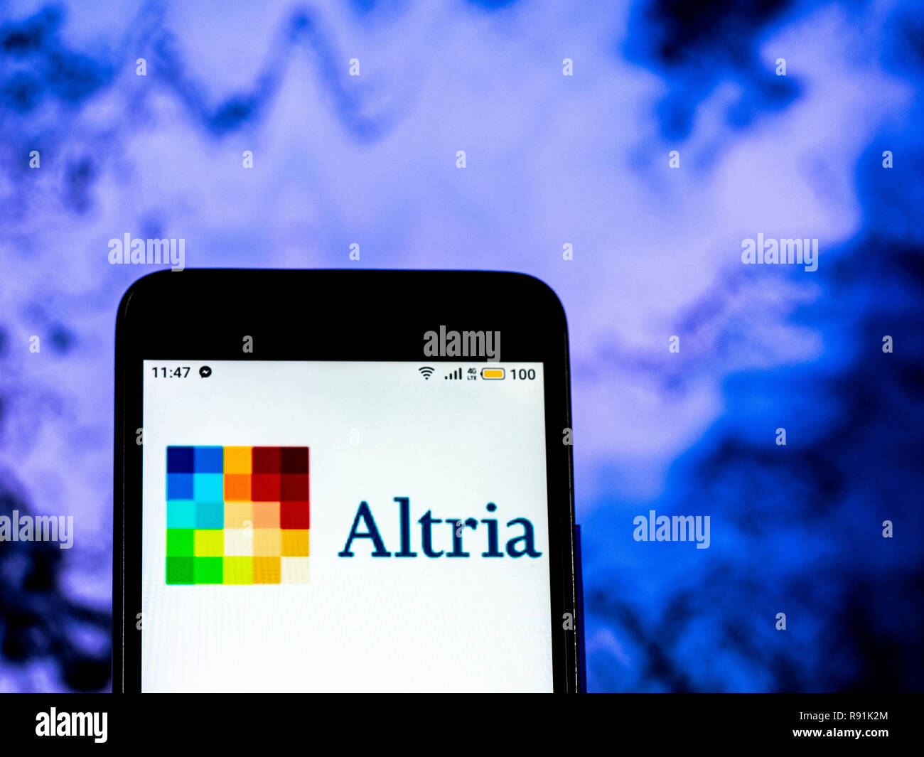 Altria Tobacco company logo seen displayed on smart phone Stock Photo ...
