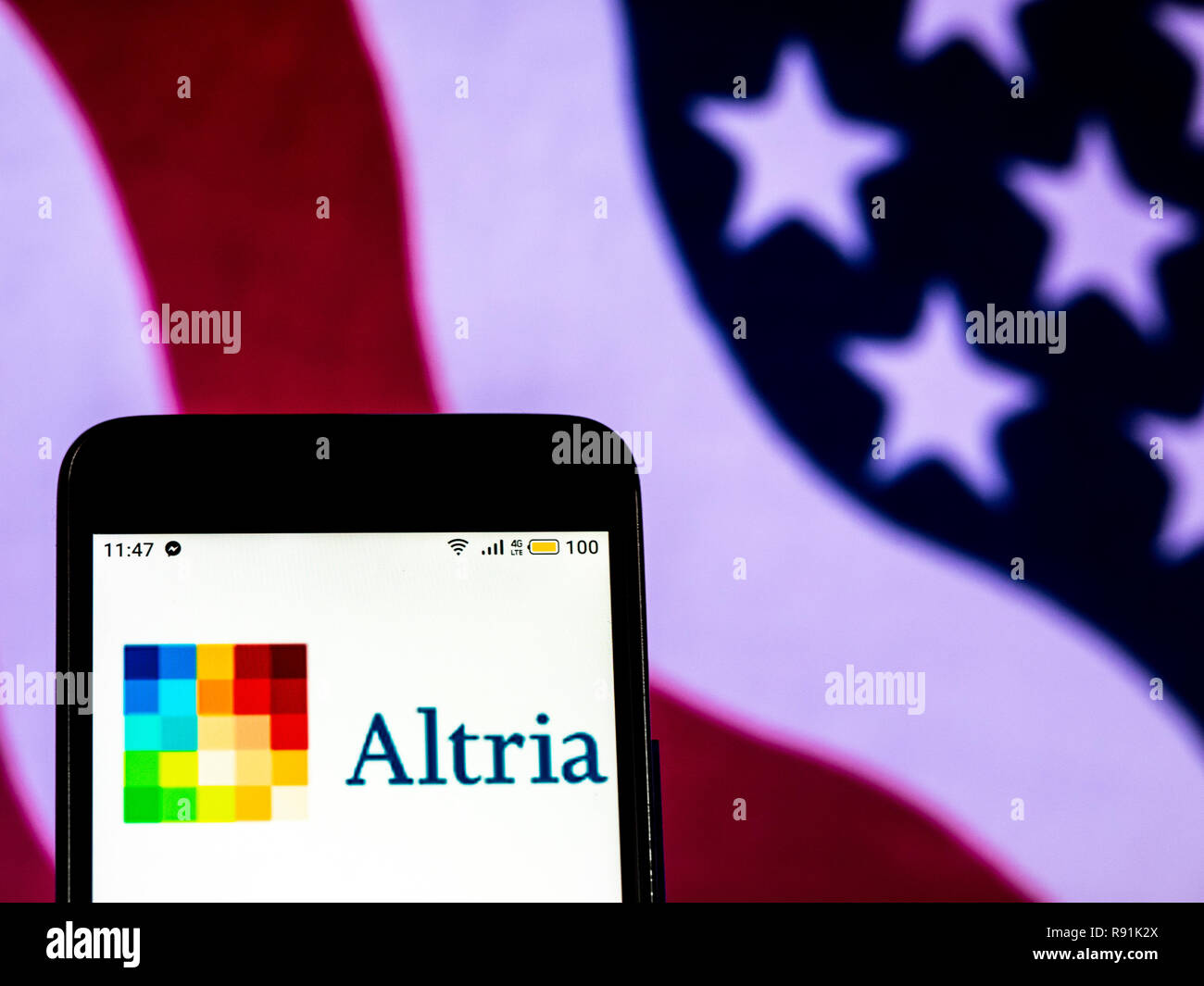 Altria Tobacco company logo seen displayed on smart phone Stock Photo ...