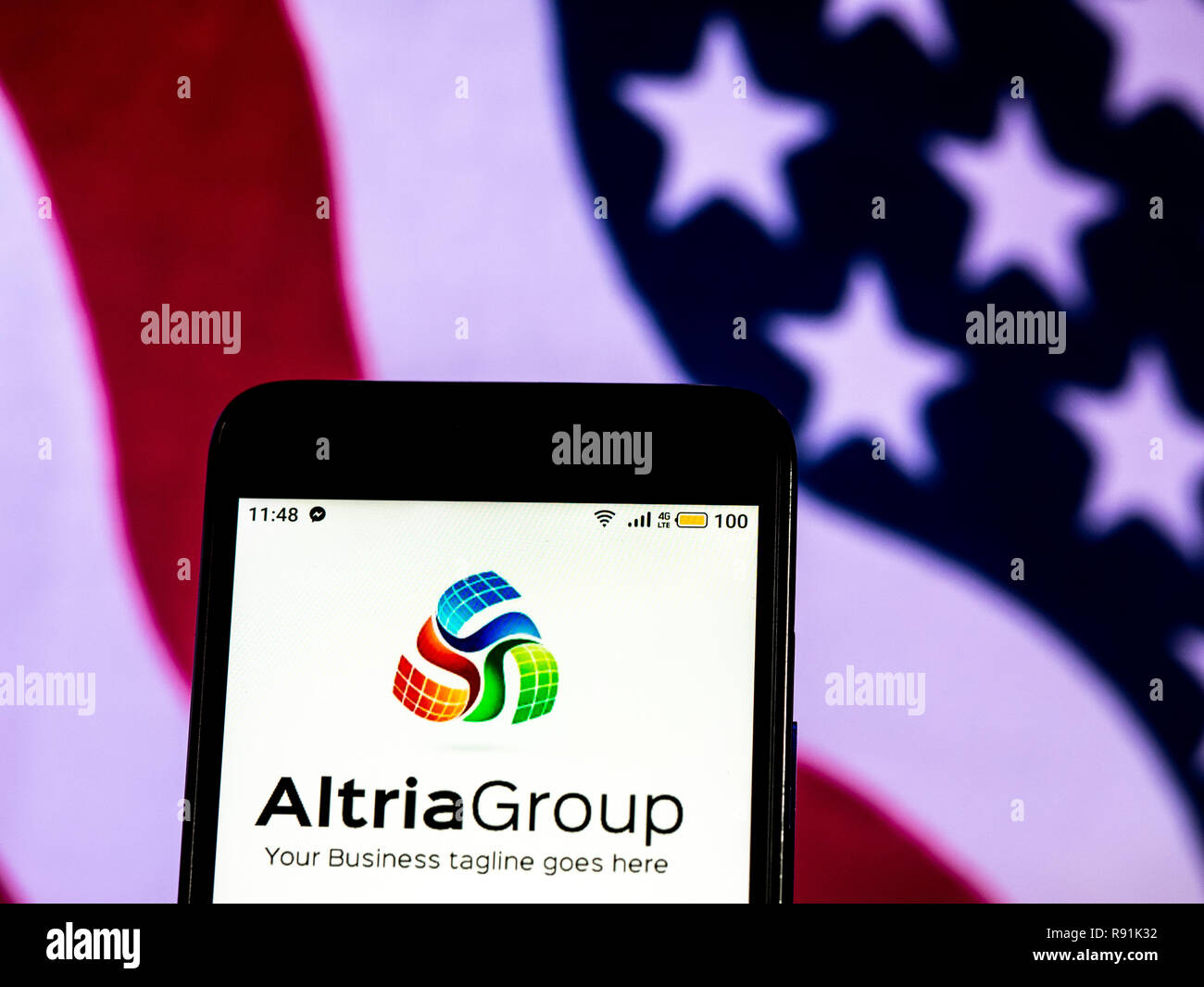 Altria Tobacco company logo seen displayed on smart phone Stock Photo ...