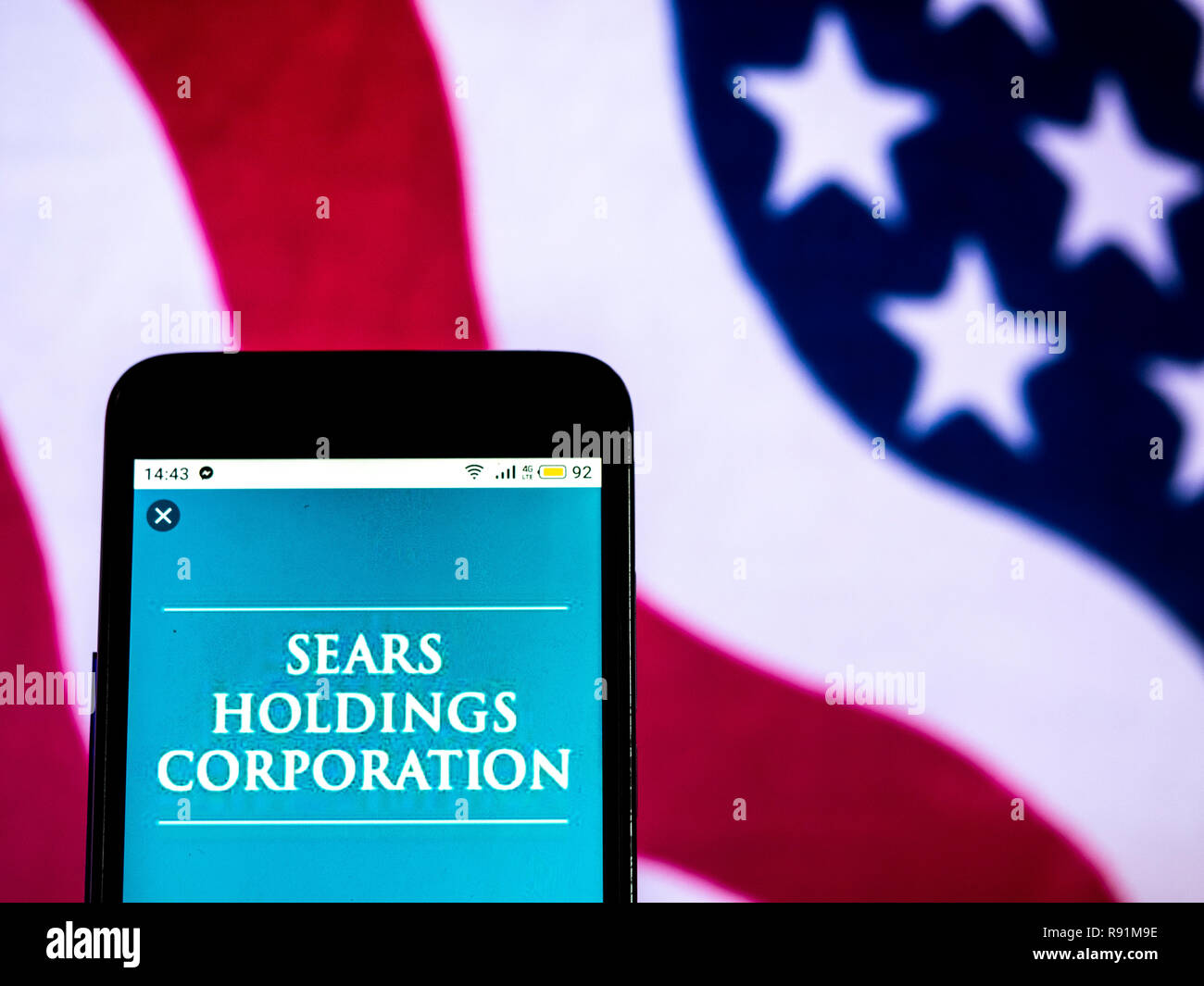 Sears Holdings Retail company logo seen displayed on smart phone Stock ...