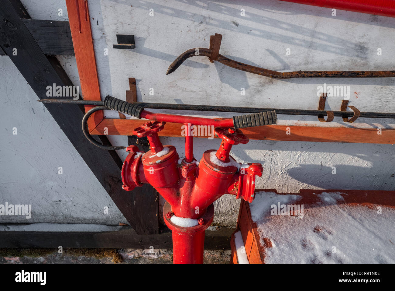 Red fire hydrant surrounded in snow. fire-fighting devices in the ...