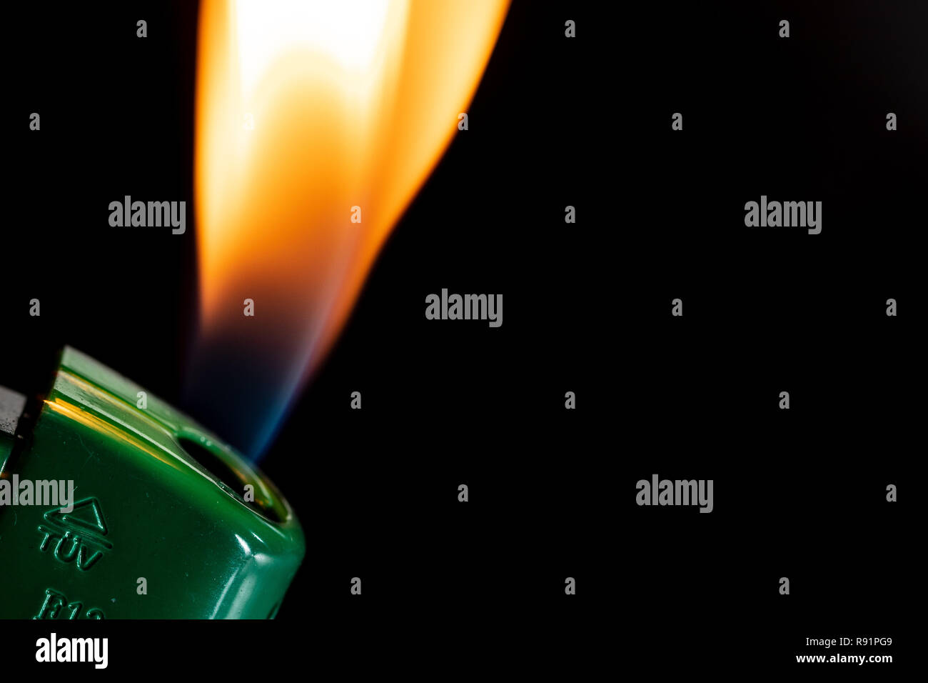 A simple close up of a lighter with flames Stock Photo - Alamy