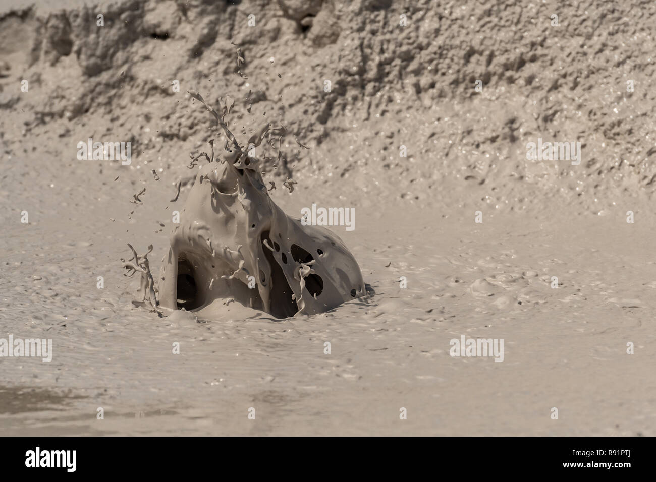 Collapsing Bubble in Muddy Hot Spring in Yellowstone Stock Photo - Alamy