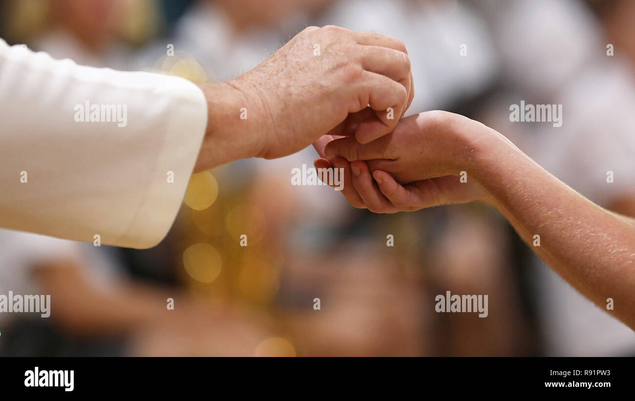 Catholic communion priest hi-res stock photography and images - Alamy