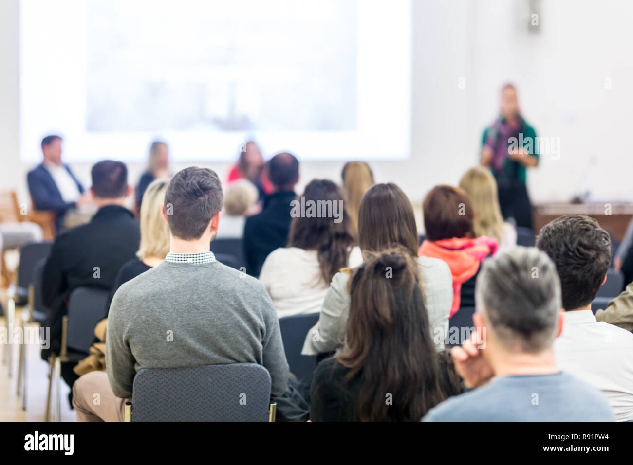 Woman giving presentation on business conference Stock Photo - Alamy