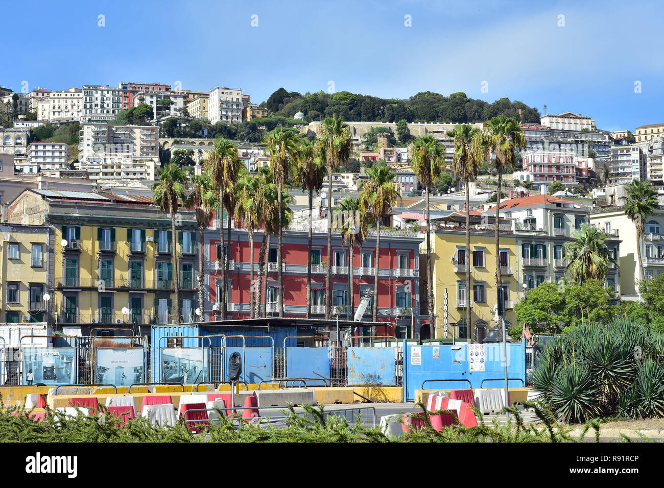 Mediterranean style apartment houses densely build on steep hill with ...