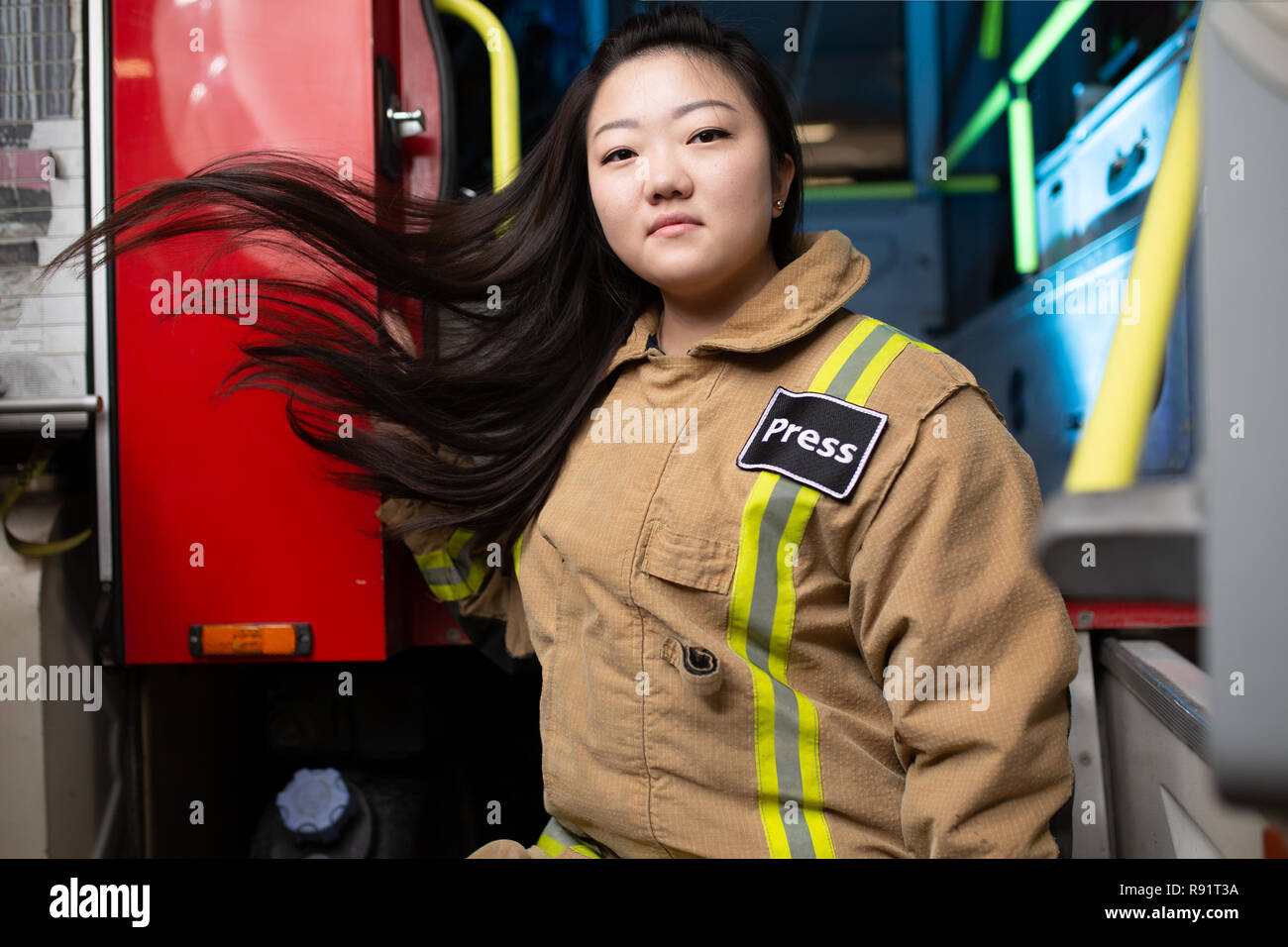 Photo of woman firefighter on background of fire truck Stock Photo - Alamy