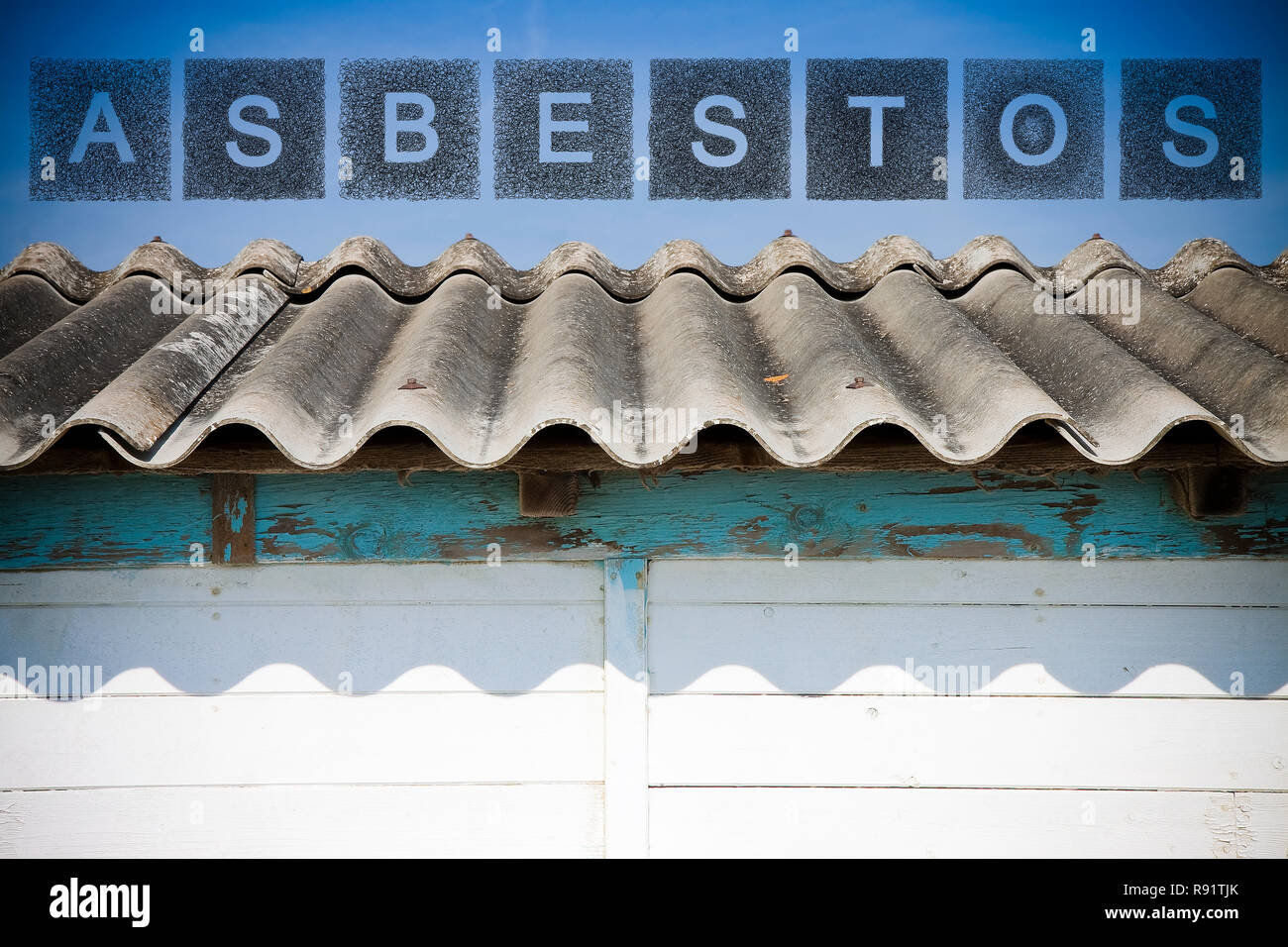 Dangerous asbestos roof. The word asbestos written with letters whose ...