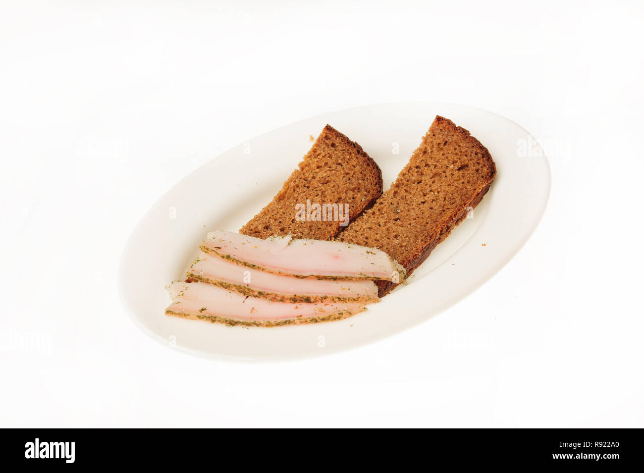 Studio shot of black bread and salo, isolated on white background Stock ...