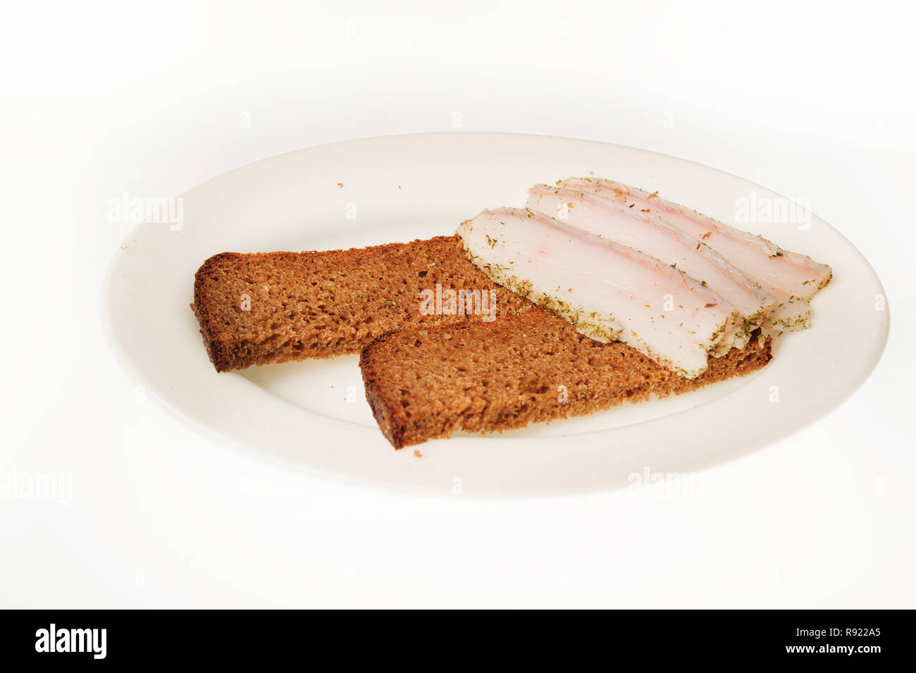 Studio shot of black bread and salo, isolated on white background Stock ...
