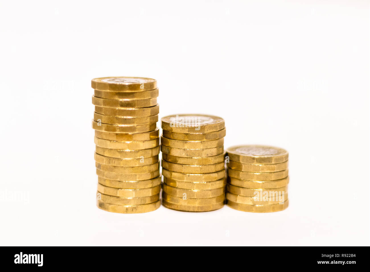 Stacks and Heaps of British GBP Golden Coins Currency Money on white ...