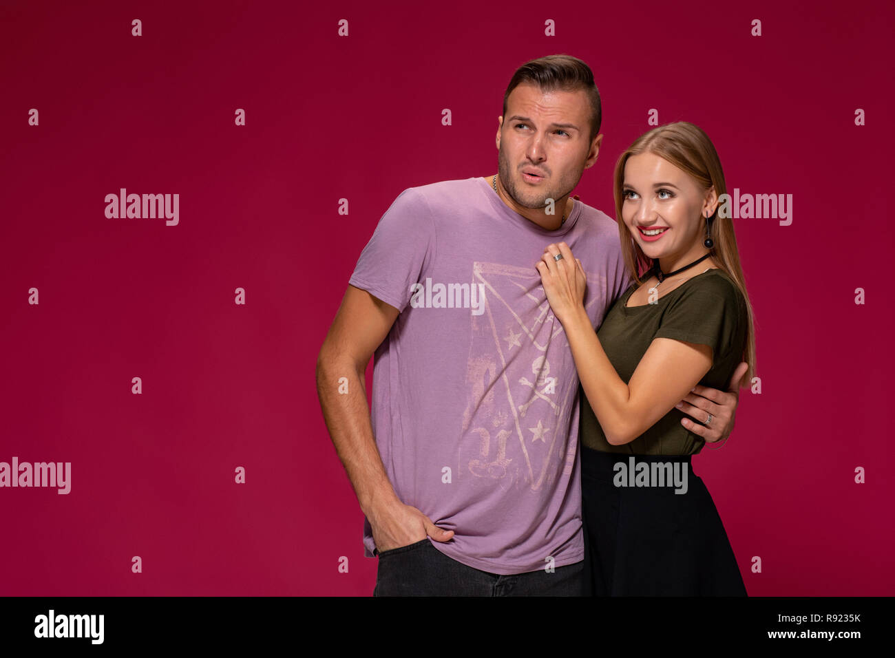 Unhappy discontent woman and man look with disgusting expression, as ...