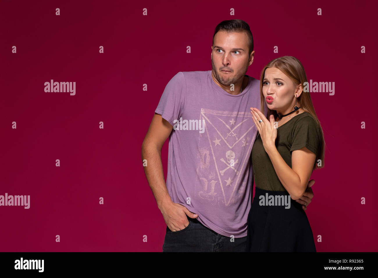 Unhappy discontent woman and man look with disgusting expression, as ...