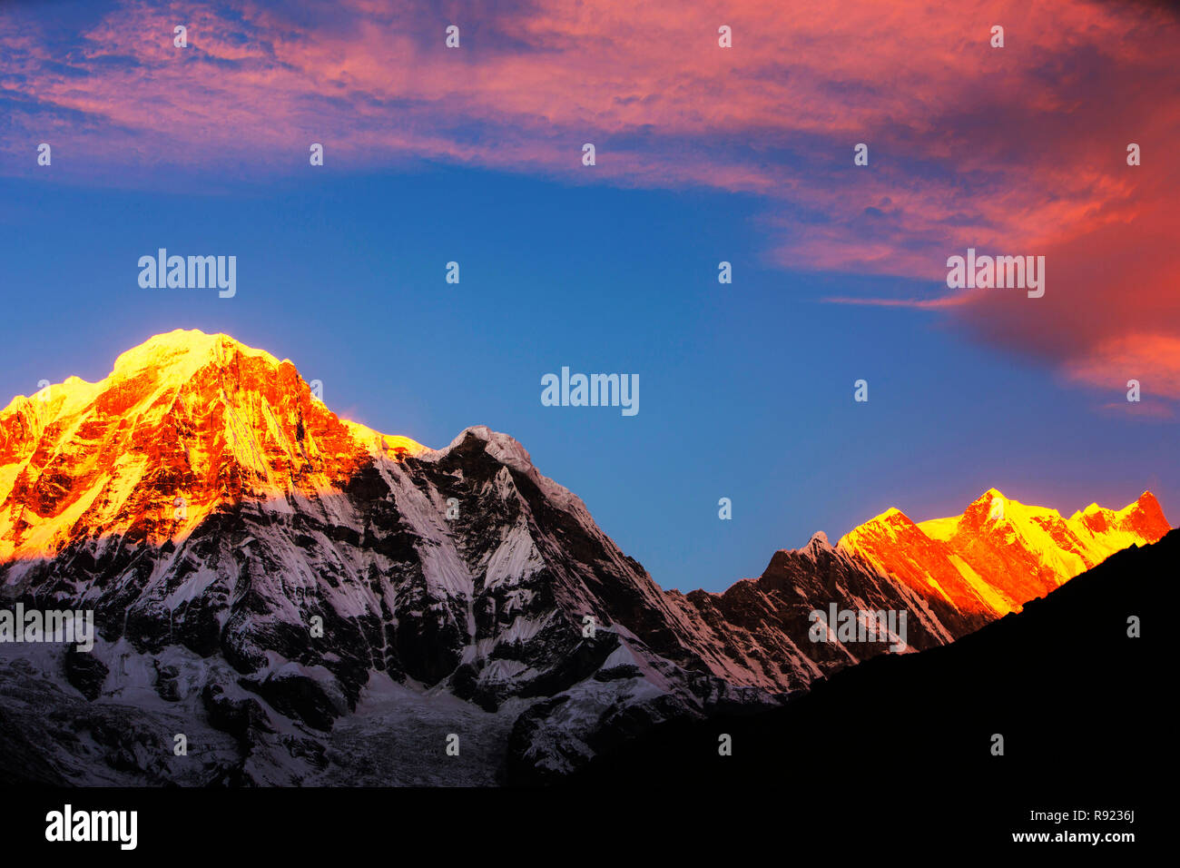 Rising sun illuminating peaks of Annapurna Himalayas, Nepal Stock Photo ...