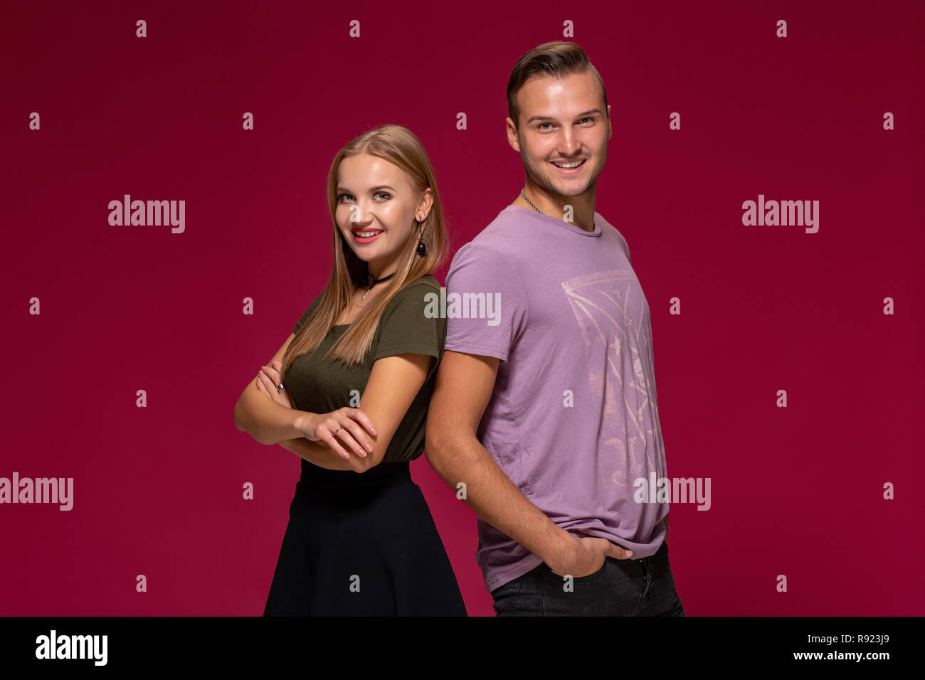 Young nice couple posing in the studio, express emotions and gestures ...
