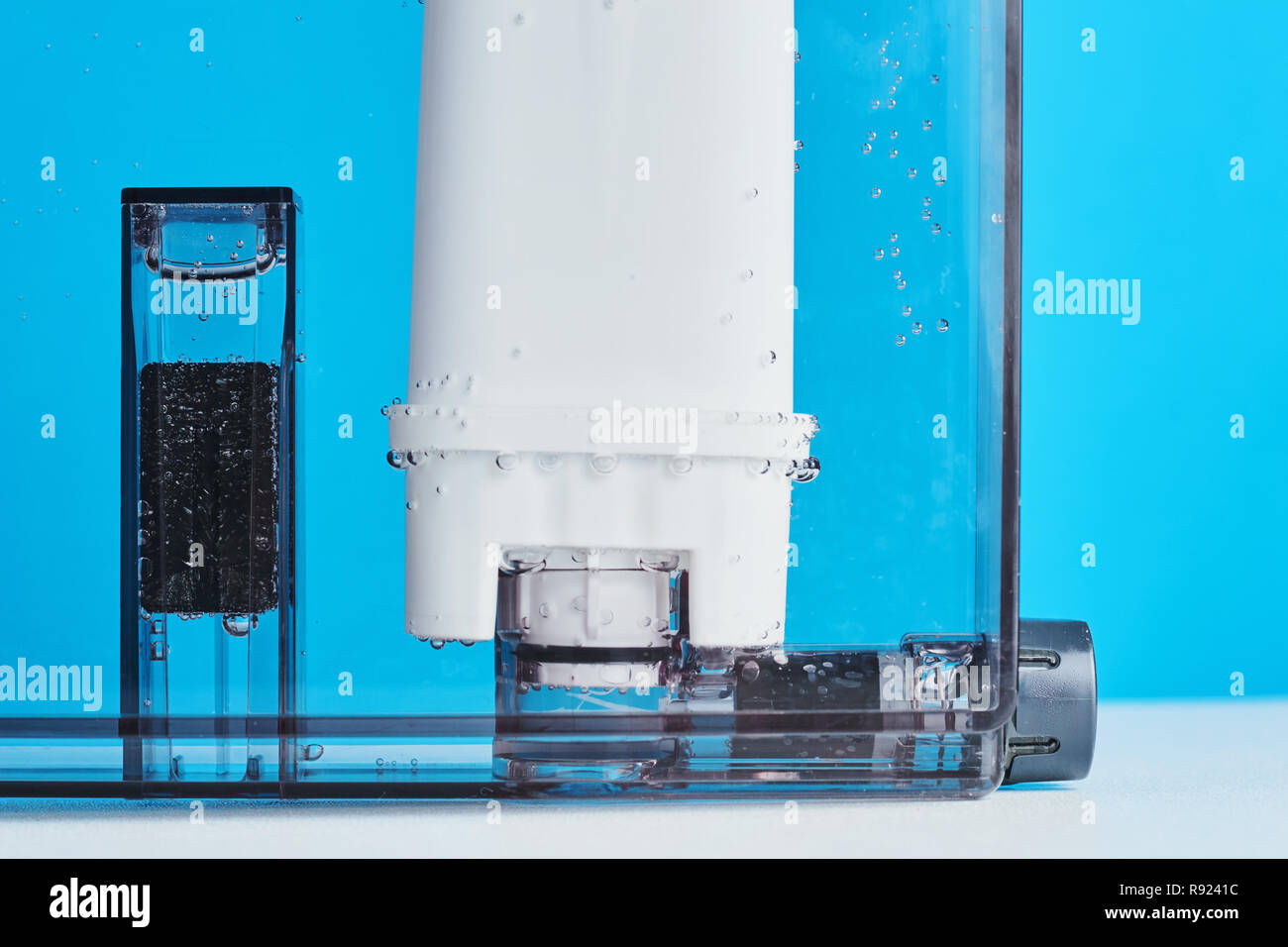 Filter water purification in coffee machine container. Kitchen ...