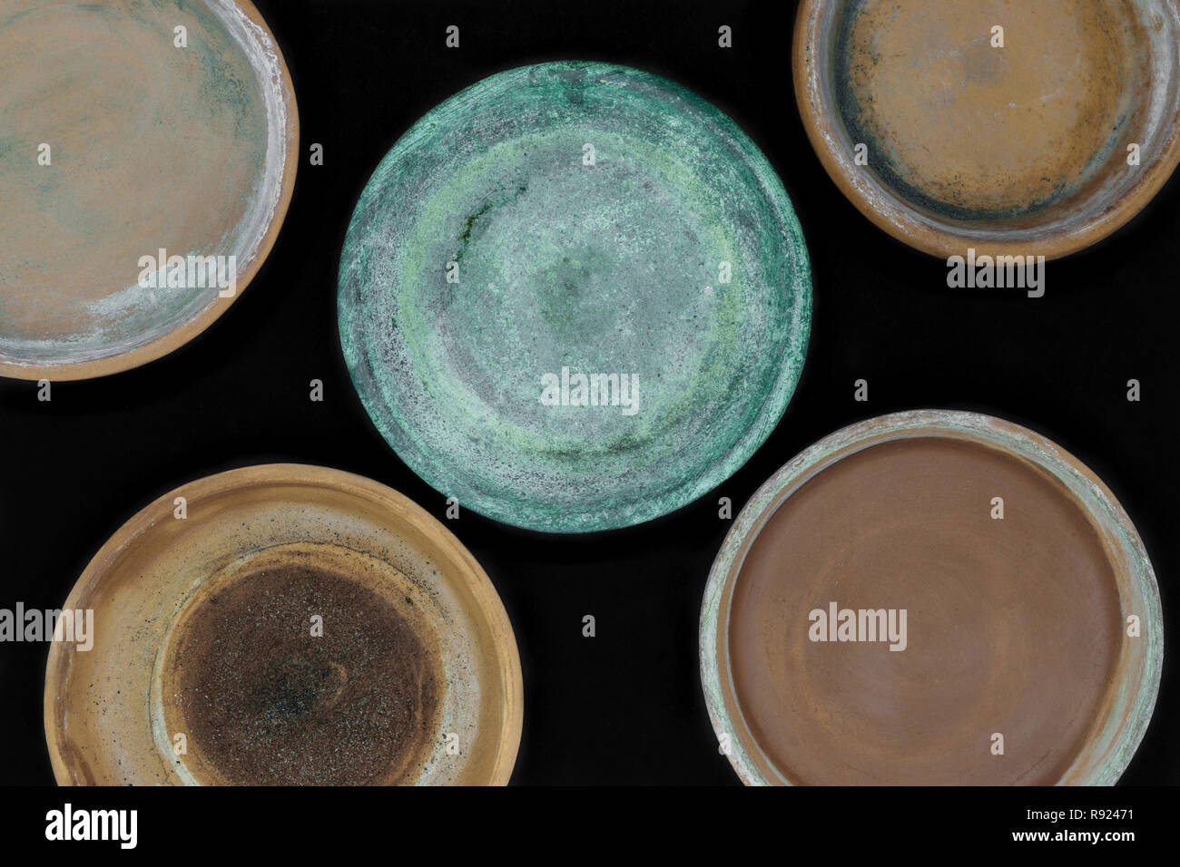 Background surface of various colors and dirty clay plates for plants ...