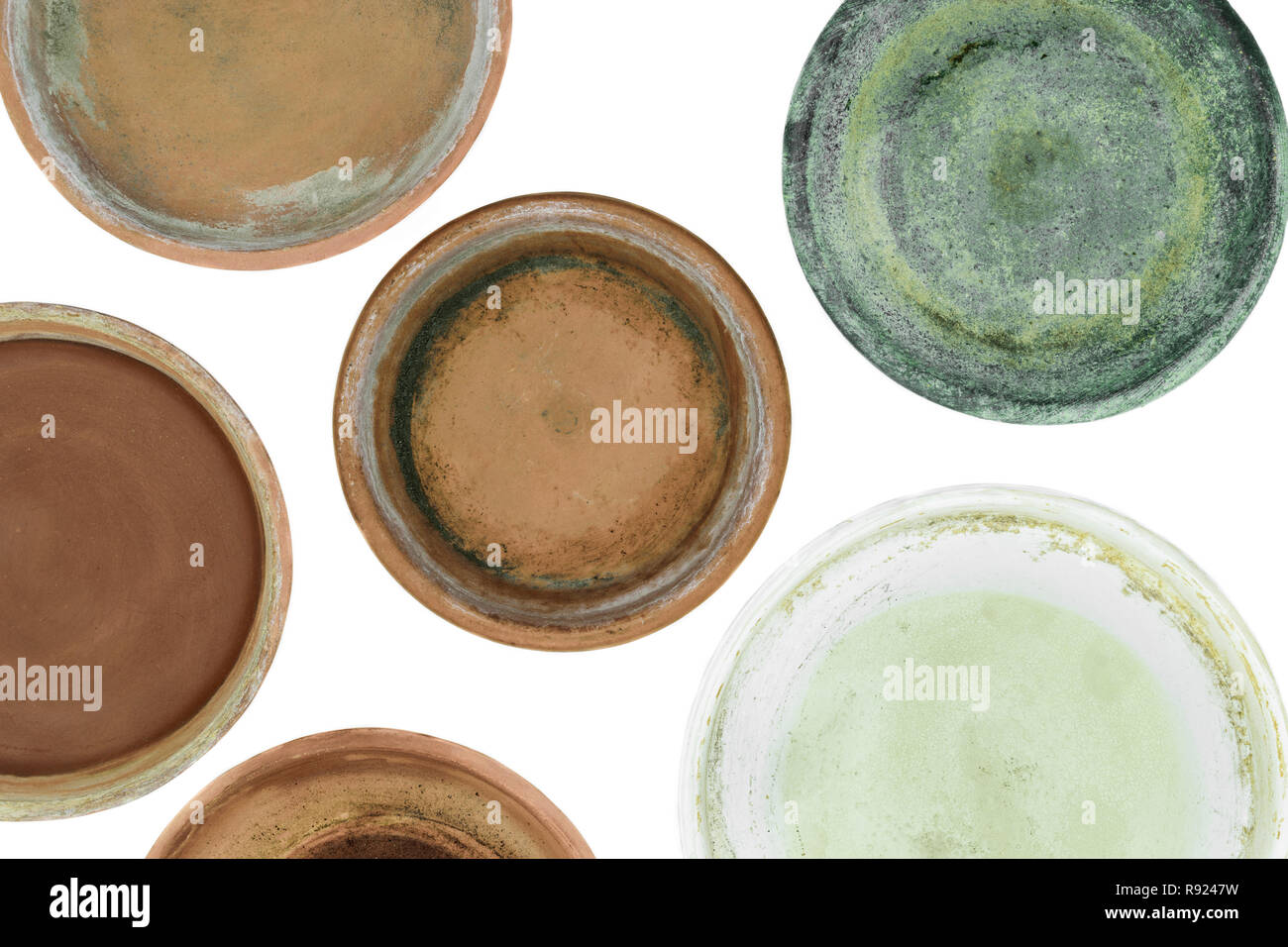 Background surface of various colors and dirty clay plates for plants ...