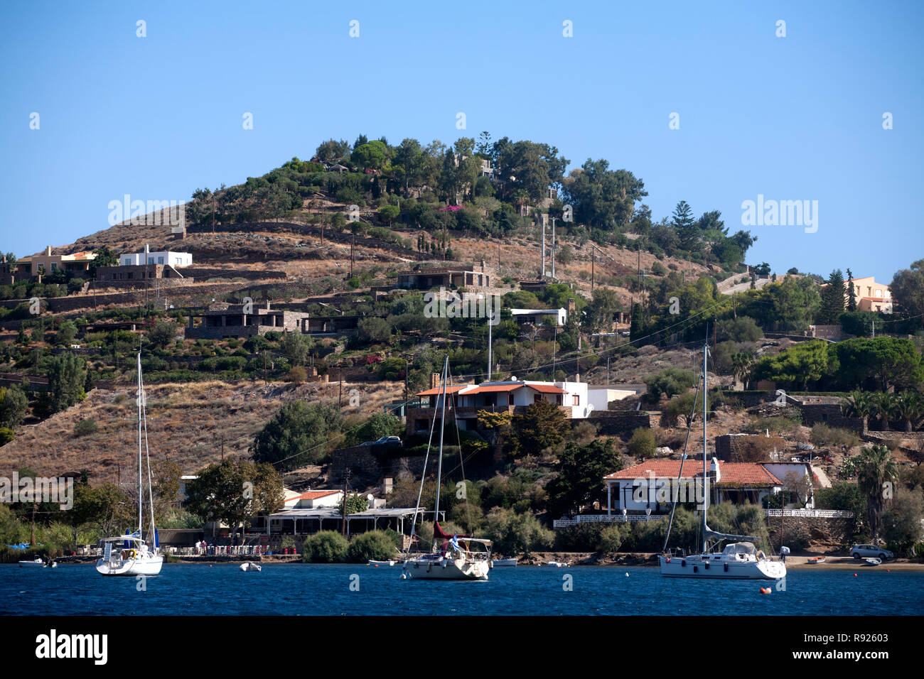 hillside houses and beach kirissia kea cyclades greece Stock Photo - Alamy