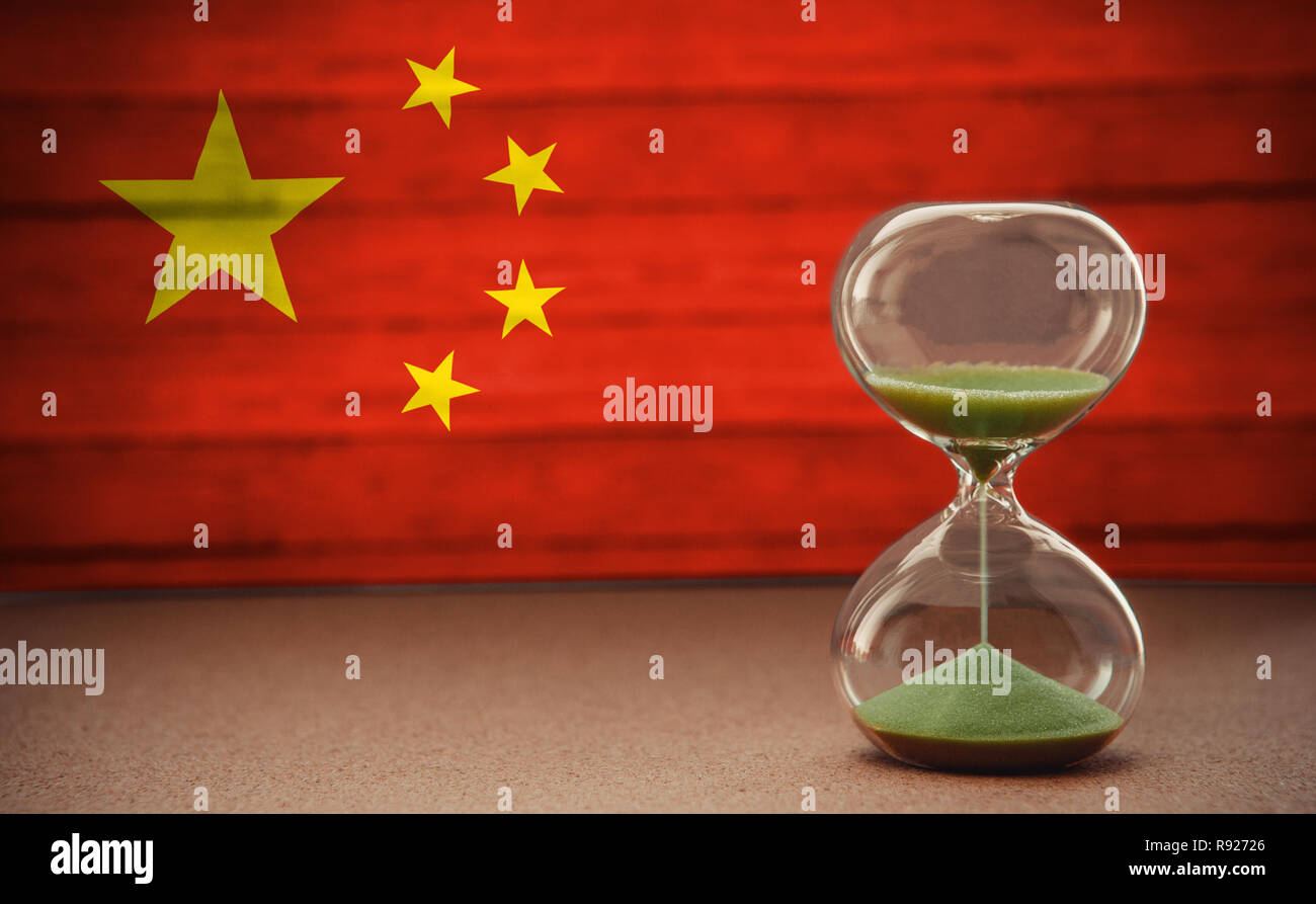 Hourglass on the background of the Chinese flag, the concept of time ...