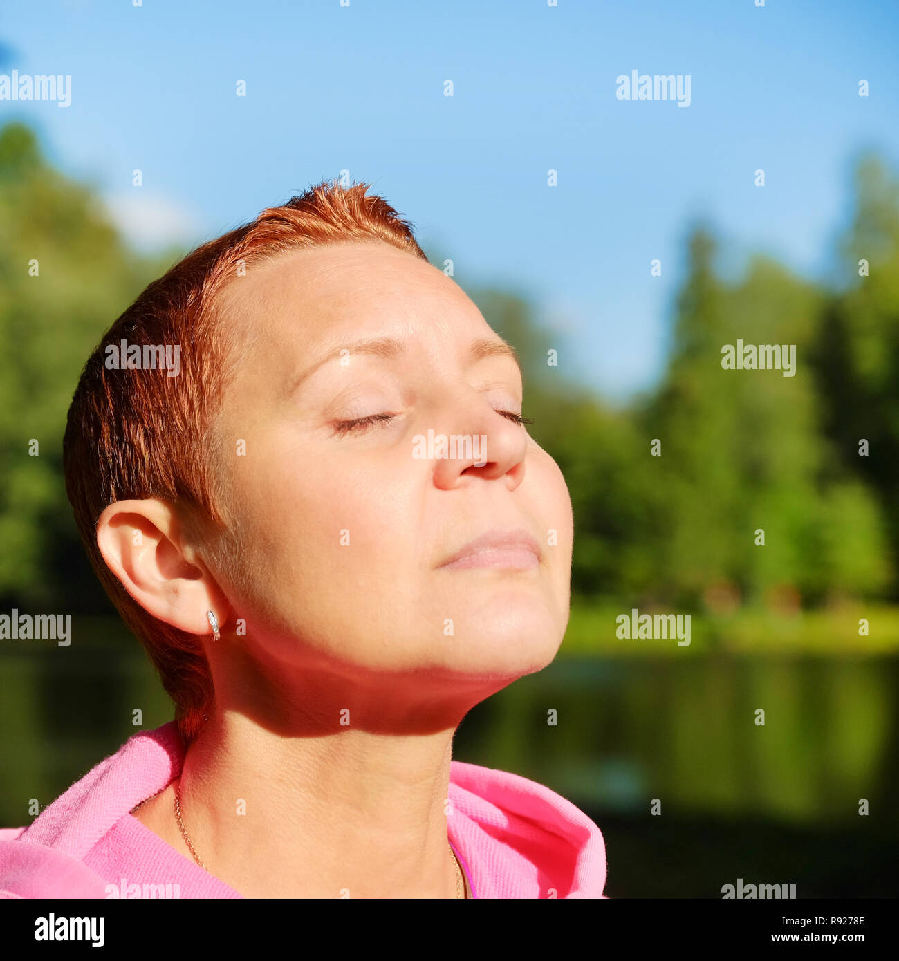 The girl's face in the sun. Health and energy is a concept of harmony ...