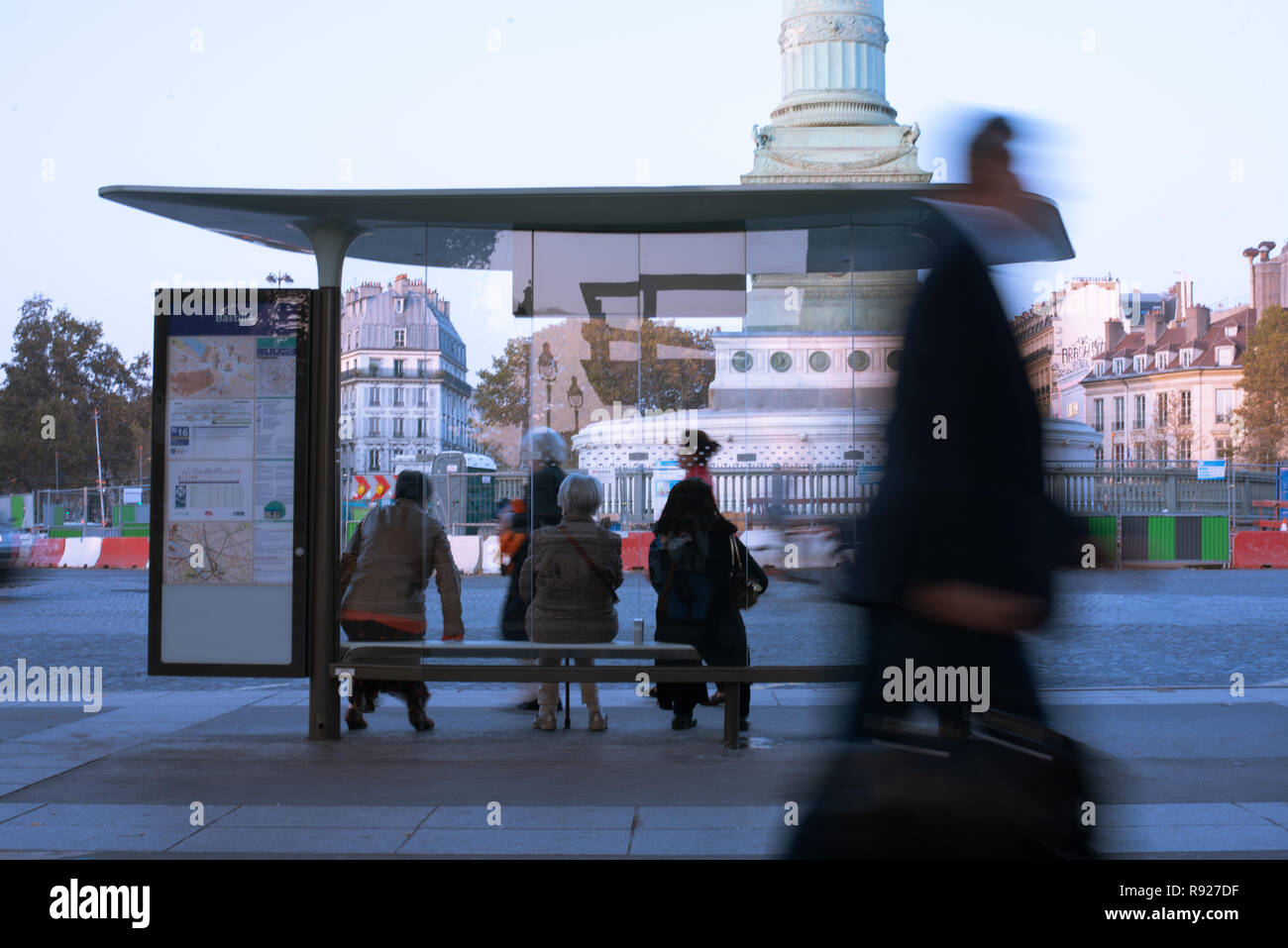 Man walking past bus stop. Place de le Bastille, Paris, France. October ...