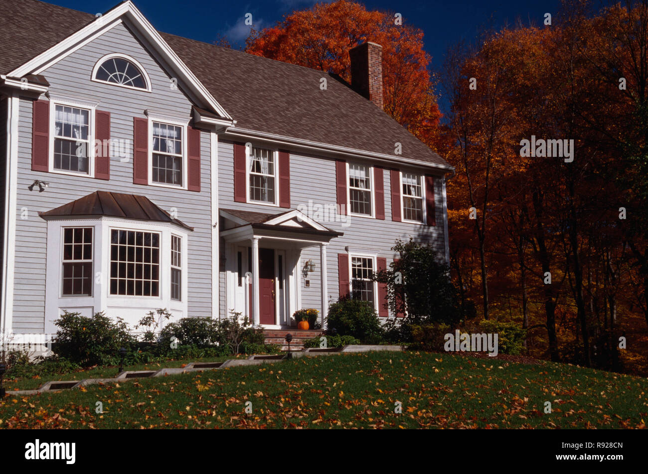 Large suburban home with fall foliage is in New England, Connecticut ...