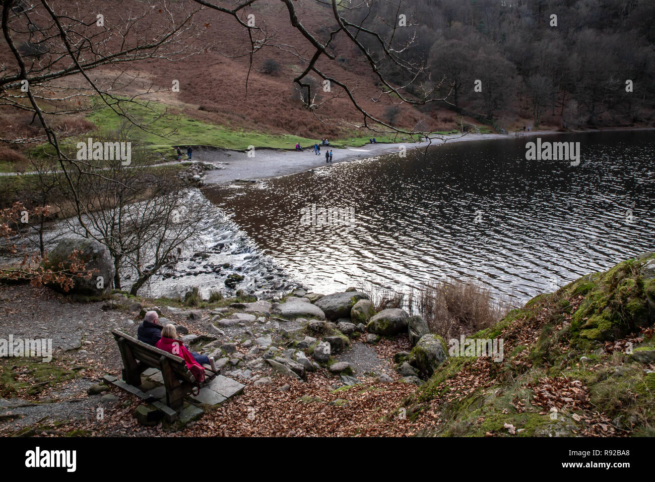 A couple relax on a bench and enjoy the scenery at the southern end of ...