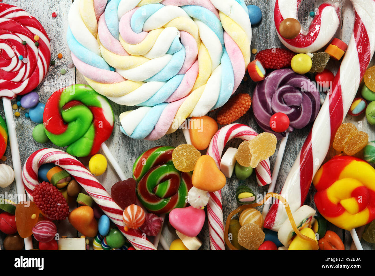 candies with jelly and sugar. colorful array of different childs sweets ...