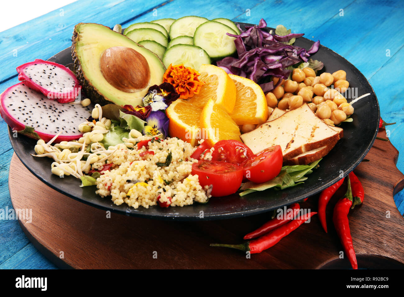 grilled tofu and dragon fruit buddha bowl with vegetable and humus ...