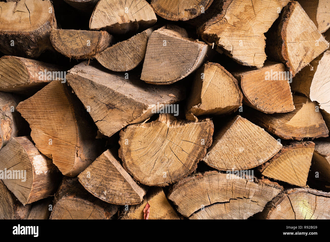 Stacked seasoned oak and beech wood. Natural background Stock Photo - Alamy