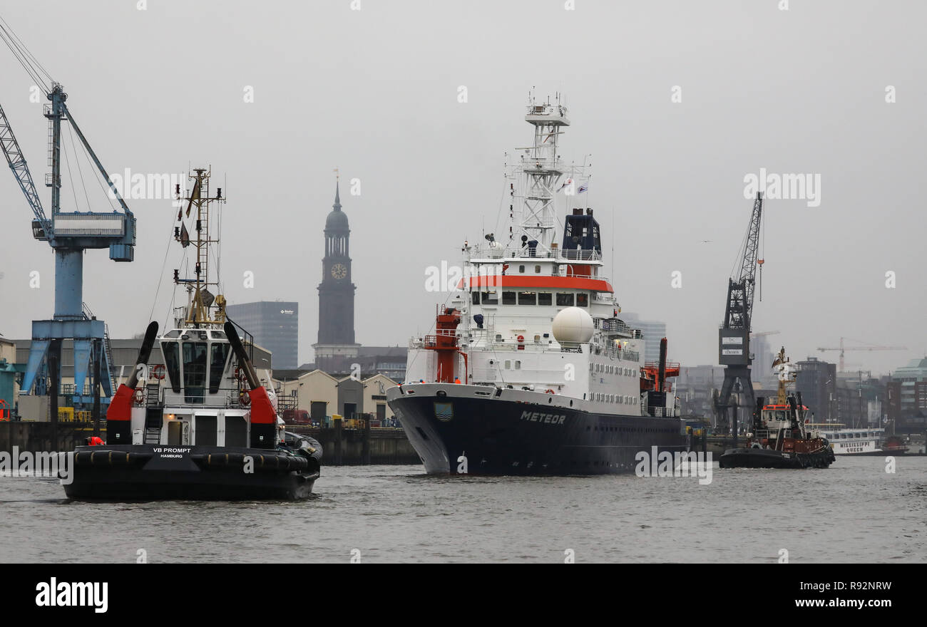 Hamburg, Germany. 19th Dec, 2018. The research vessel "Meteor" (M) is ...