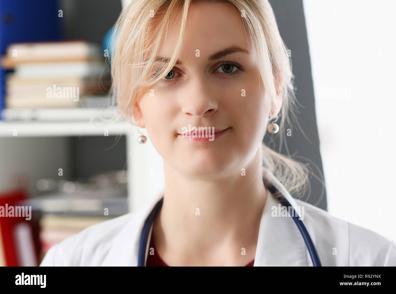Beautiful smiling female doctor at workplace portrait Stock Photo - Alamy