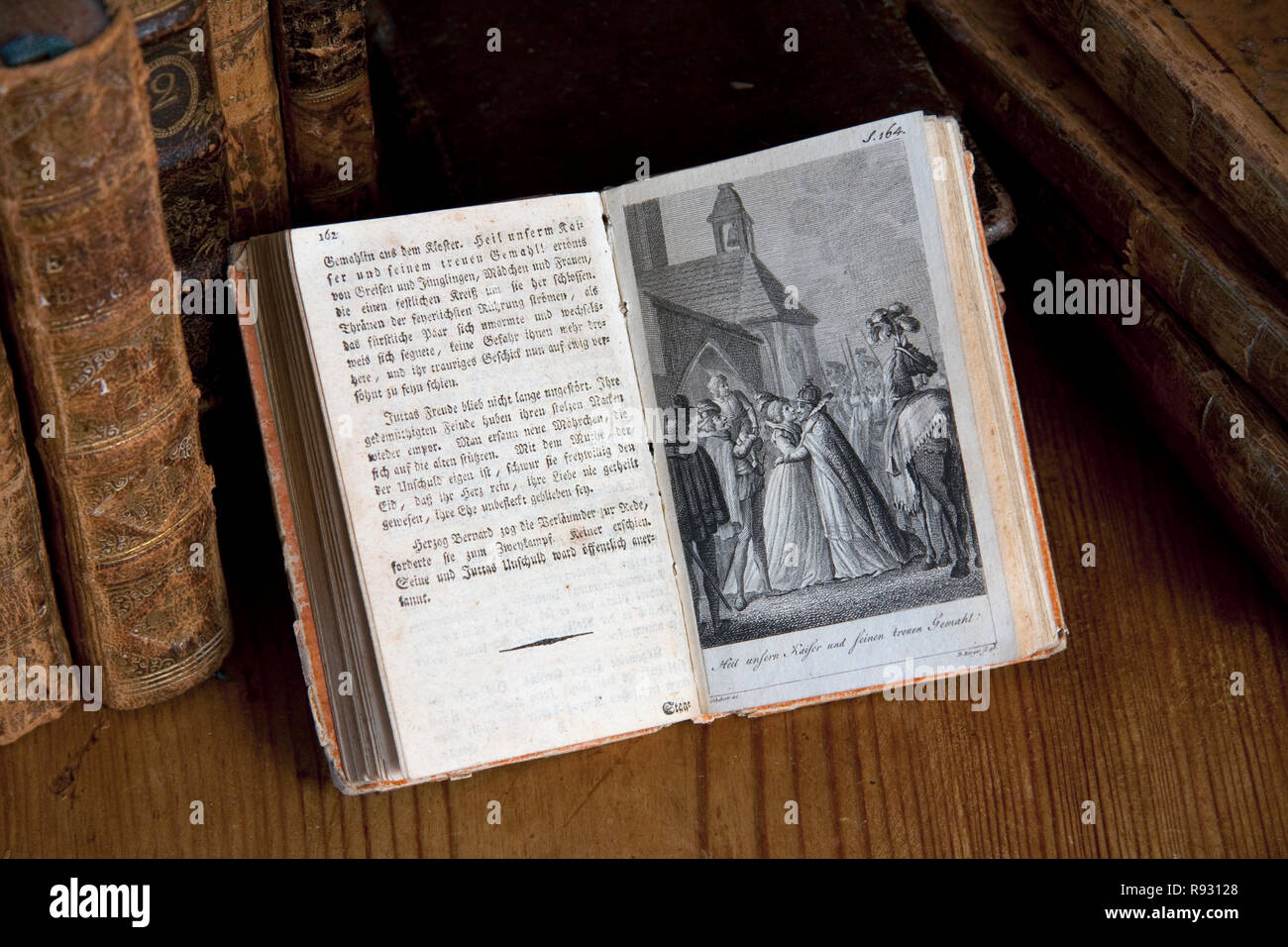 Old antique vintage illustrated books Stock Photo - Alamy