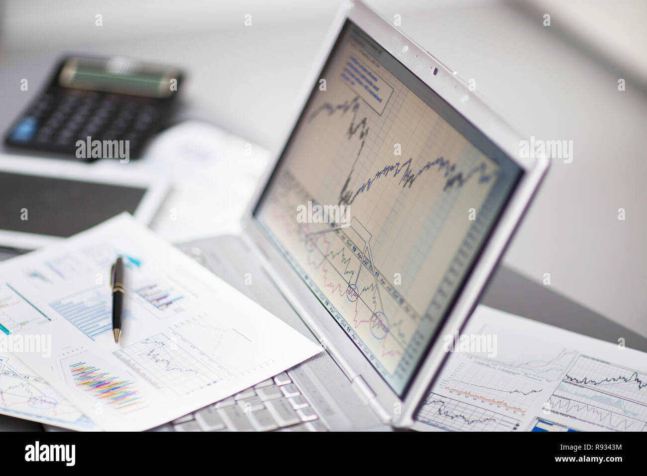 Businessman analyzing investment charts with laptop. Accounting Stock ...