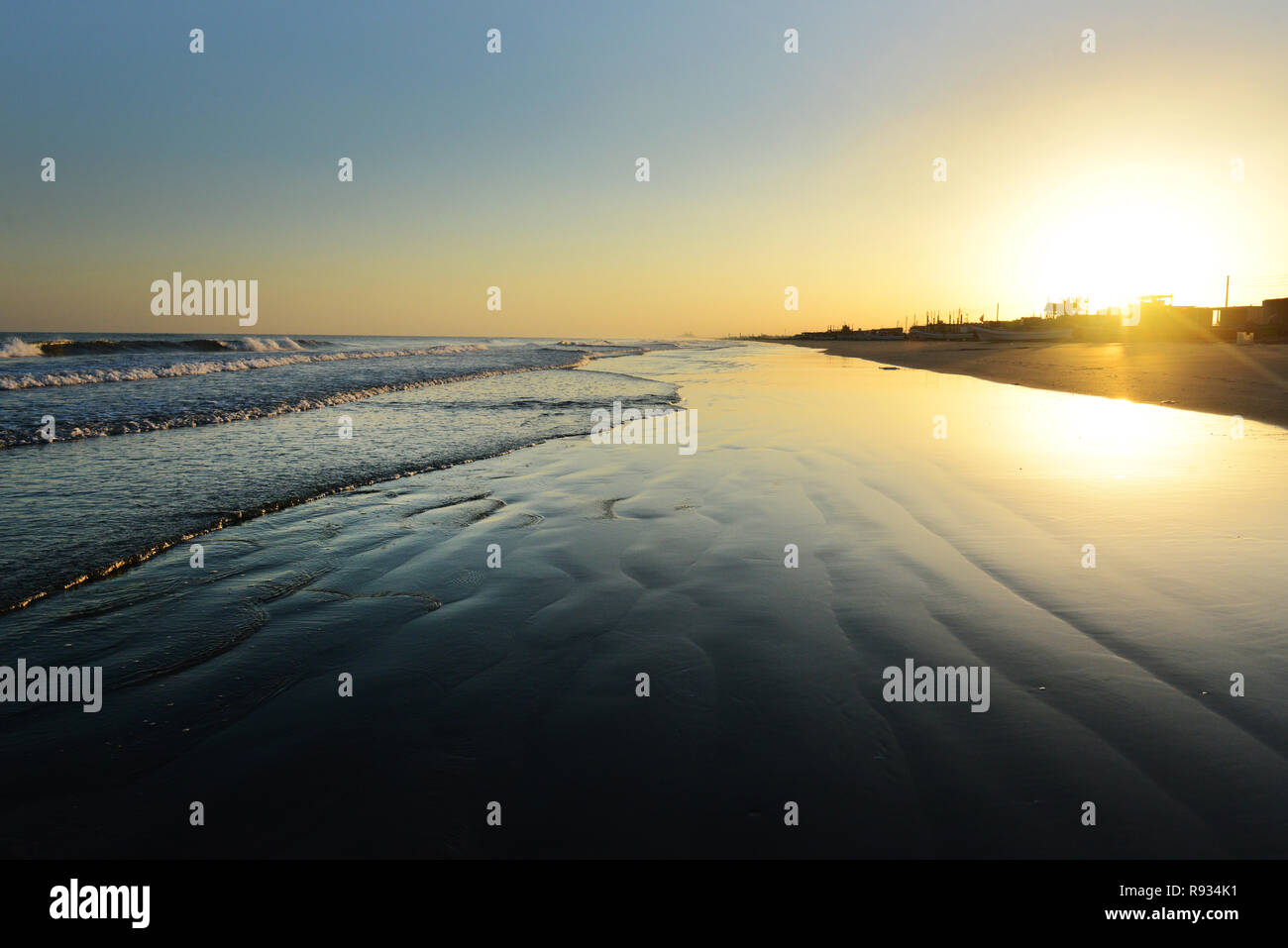 Sunrise over the Barka beach in Oman Stock Photo - Alamy